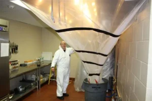 technician cleaning hood duct - Northland Fire